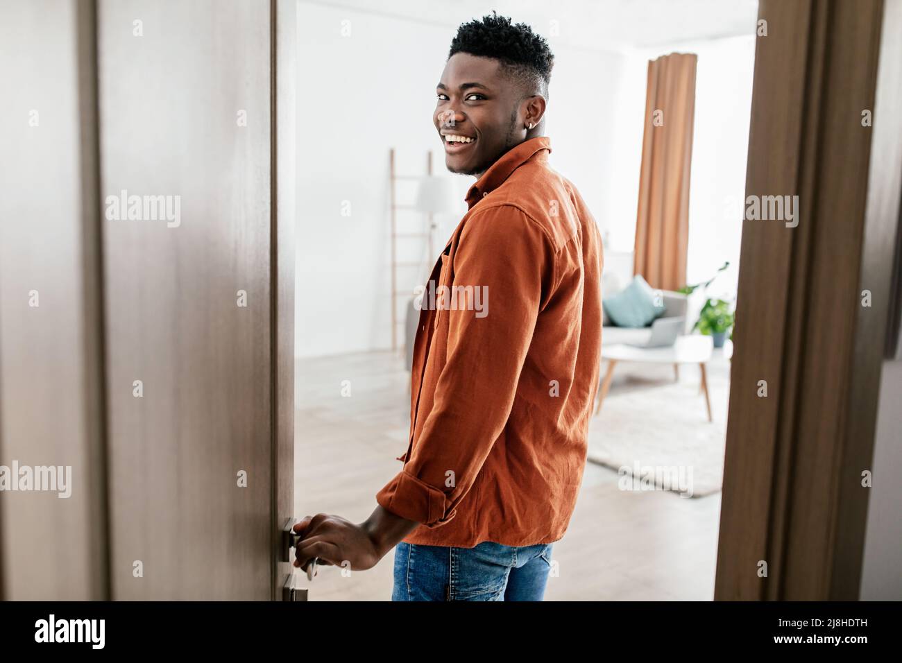 Person entering door hi-res stock photography and images - Alamy