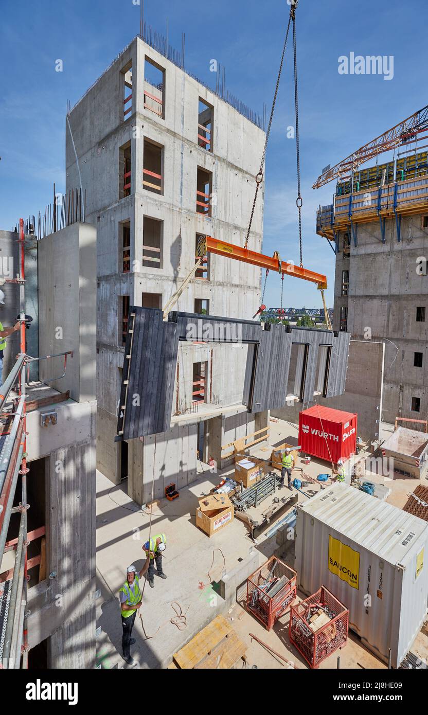 Hamburg, Germany. 16th May, 2022. An exterior wooden element is lowered ...