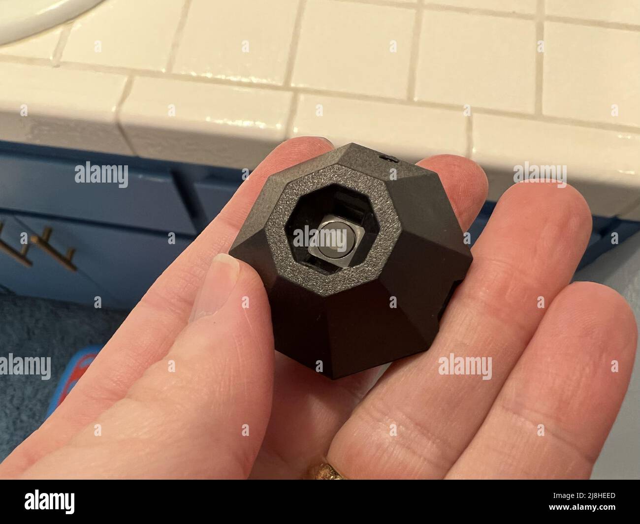 Person's hand holding the Nix Mini 2 color sensor, Lafayette ...