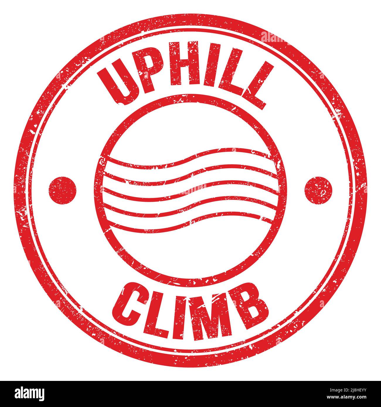 UPHILL CLIMB text written on red round postal stamp sign Stock Photo ...
