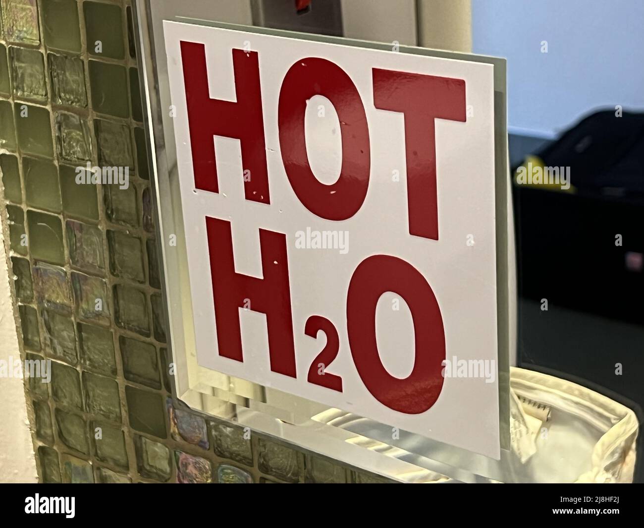 Sign reading Hot H2O warning about extremely hot water in sink in San ...