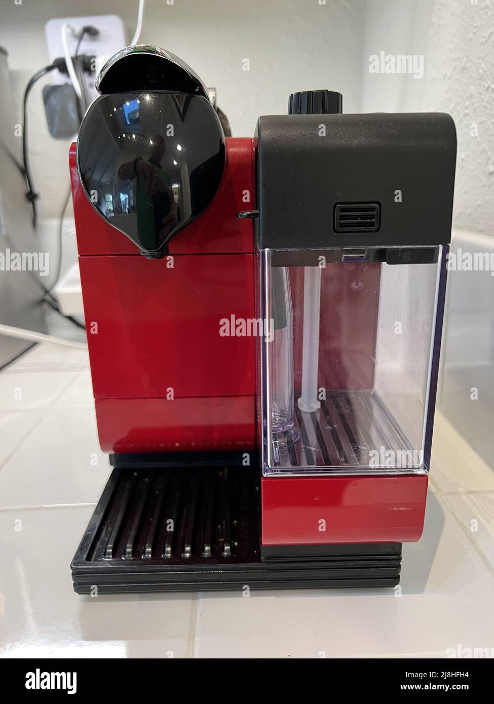 Red-colored Nespresso single-serving espresso maker from DeLonghi on ...