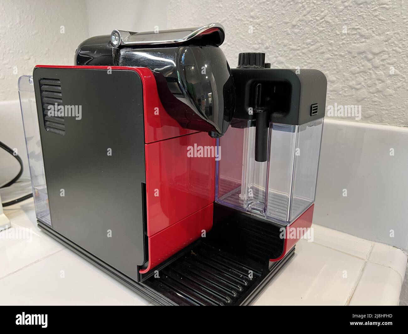 Red-colored Nespresso single-serving espresso maker from DeLonghi on ...