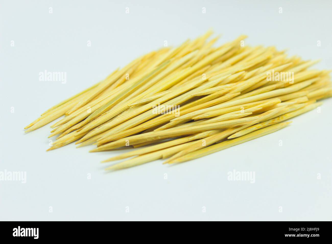 Pile of wooden toothpicks isolated on white background Stock Photo - Alamy