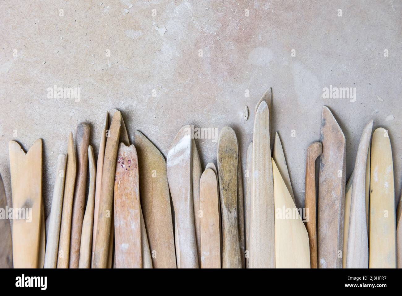 Wooden pottery tools set on a ceramics studio background Stock Photo ...