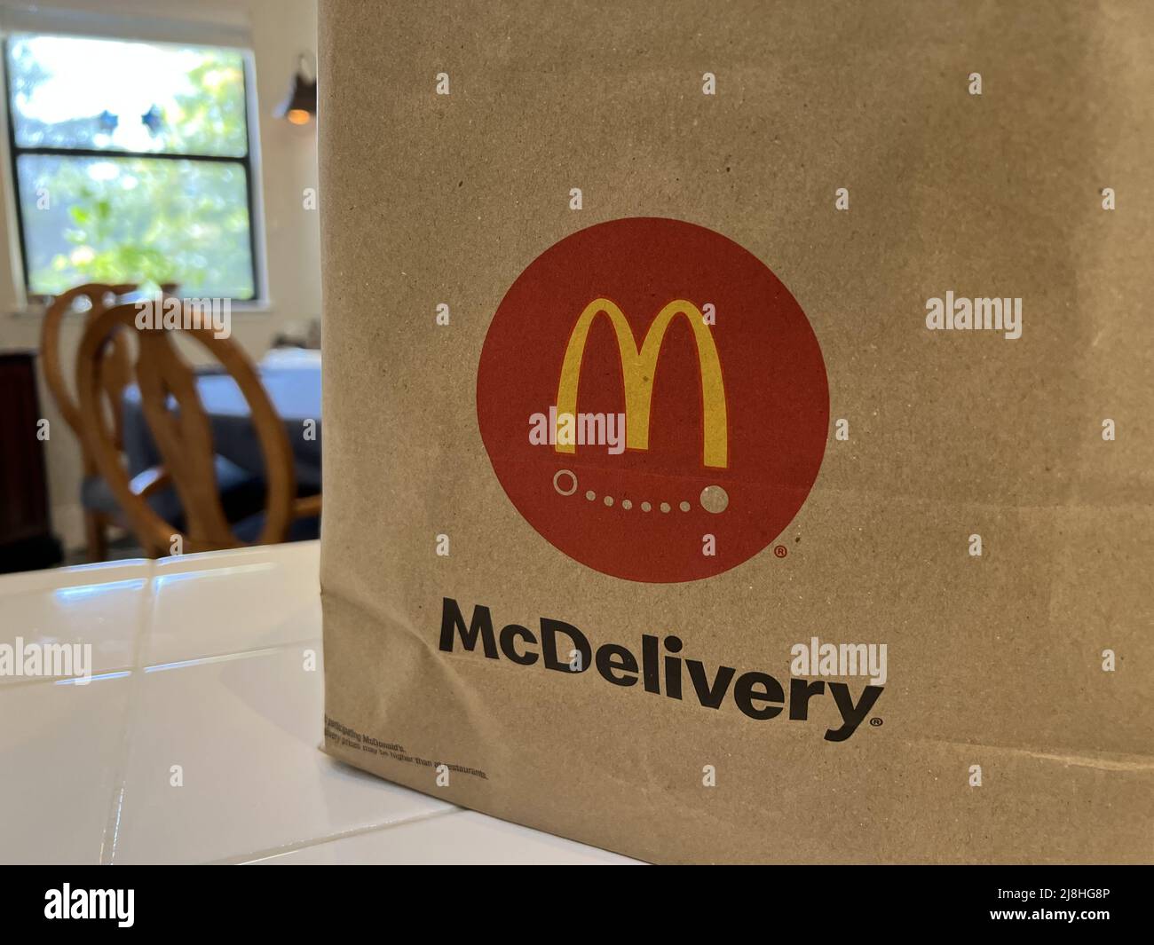 Close-up of bag with logo for McDonald's delivery, McDelivery ...
