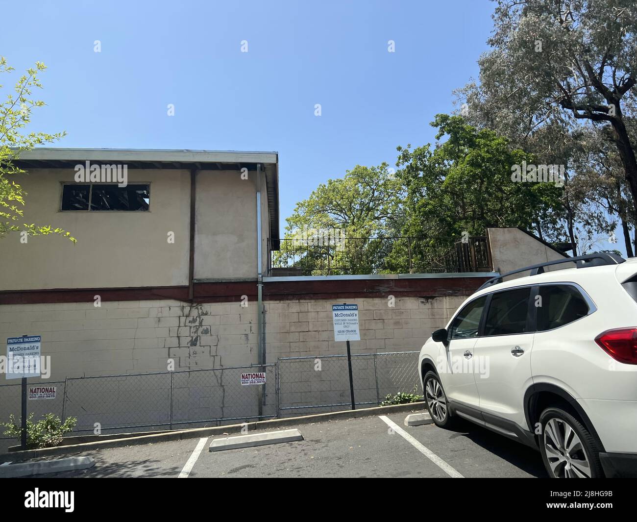Scorch marks are visible on a building damaged in a fire in Lafayette ...