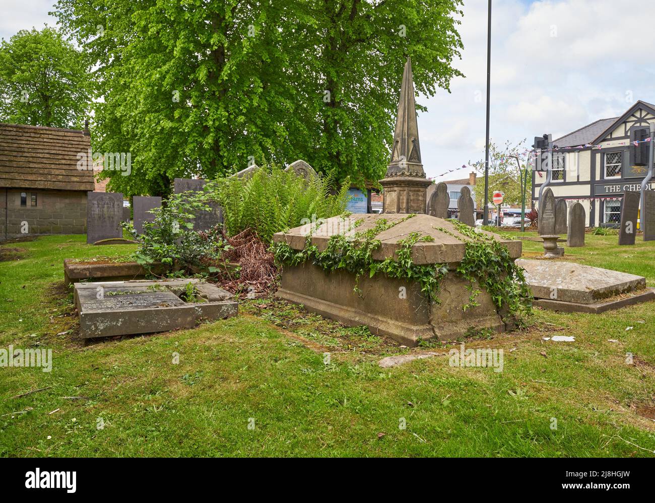 Old overgrown stone grave in Breaston, Derbyshire, UK Stock Photo - Alamy