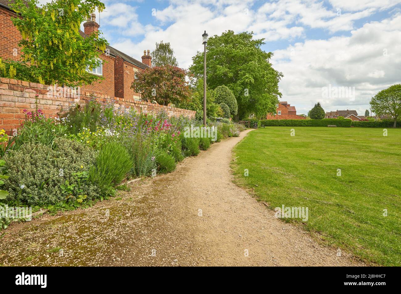 Park path and gardens in Breaston, Derbyshire, UK Stock Photo - Alamy