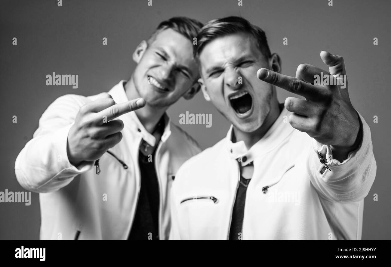 two cousin show middle finger. young confident brothers. confident ...