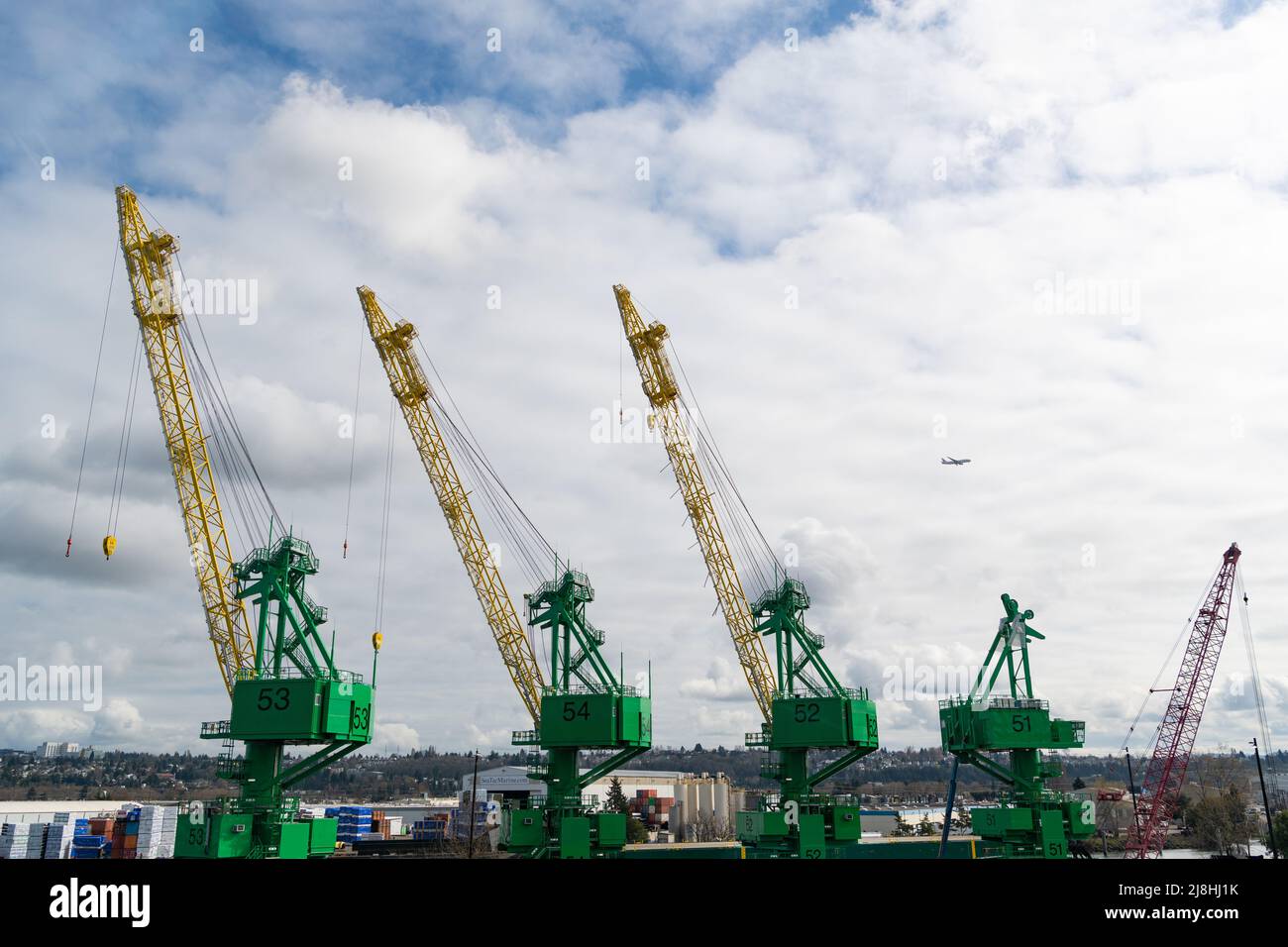 construction cranes in port. industrial area with crane Stock Photo - Alamy