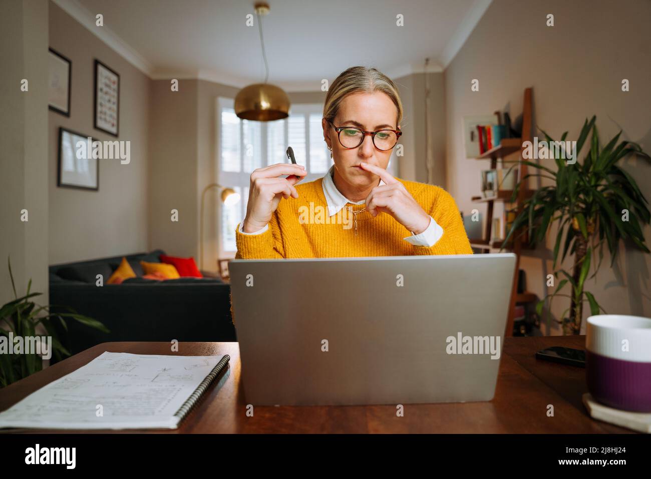 Woman working documents home hi-res stock photography and images - Alamy