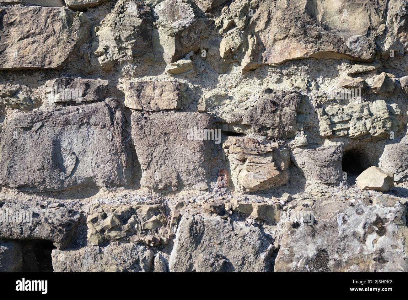 Old stone wall background, dark rock surface Stock Photo - Alamy