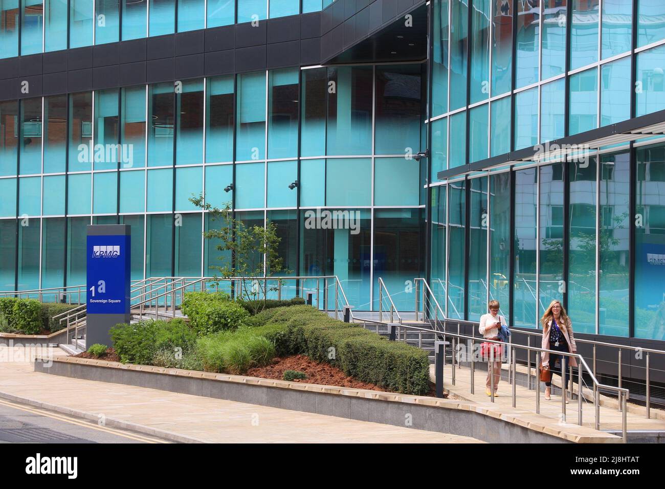 LEEDS, UK - JULY 11, 2016: People walk by KPMG building in Leeds, UK ...