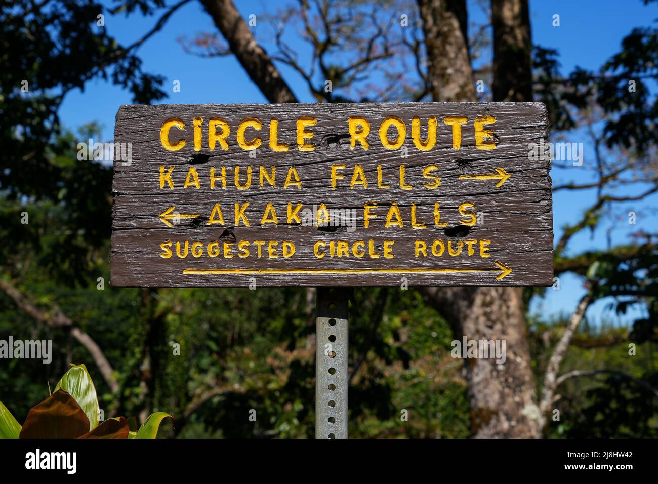 Wooden directions sign at the trailhead of the circle route of Akaka ...