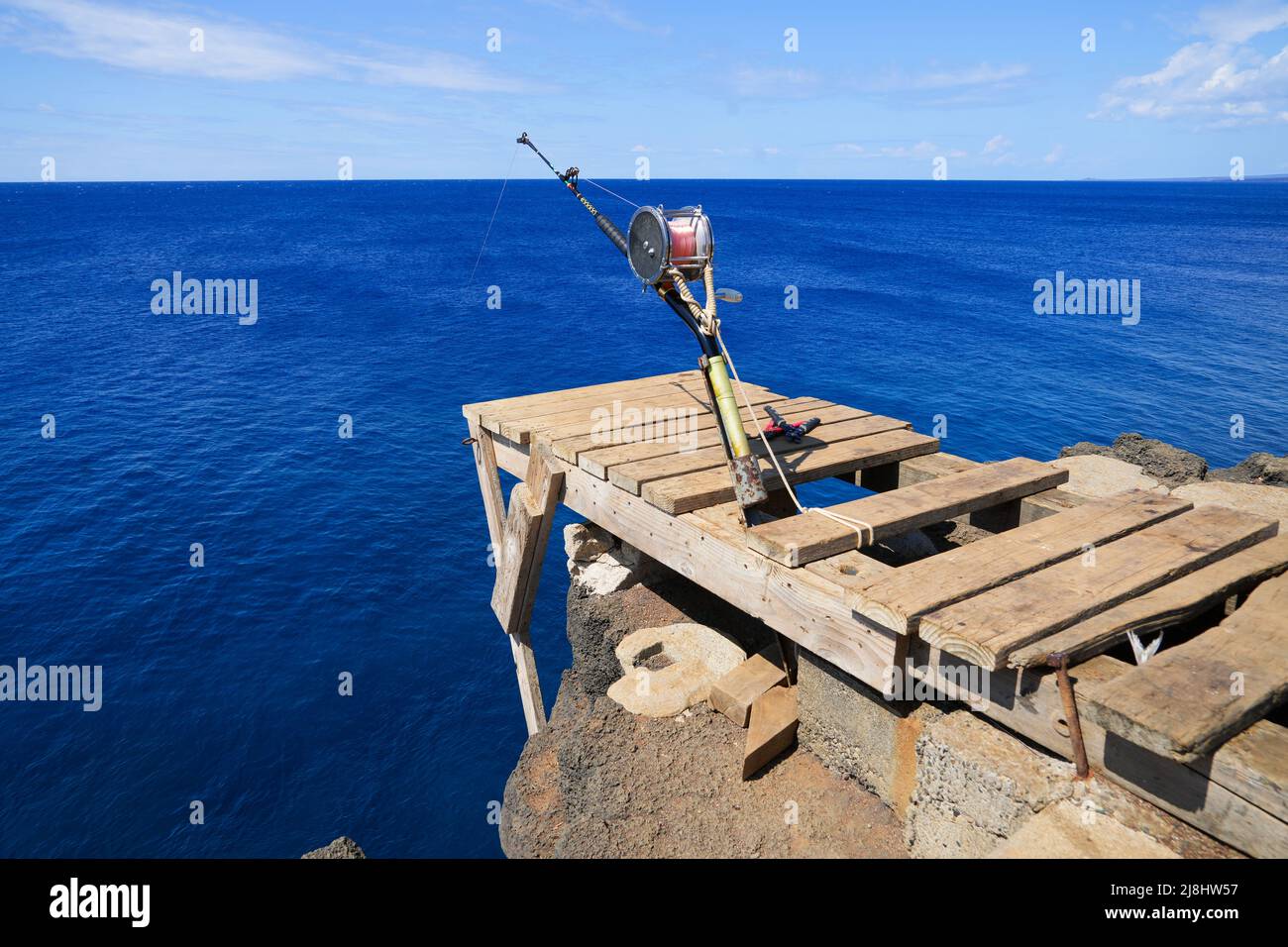 Wooden platform with a fishing rod over the Pacific Ocean in South ...