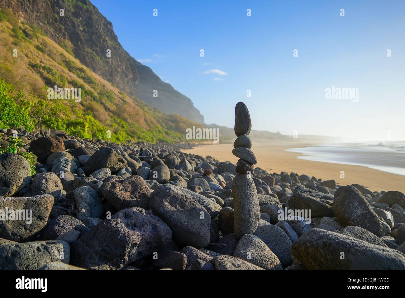 Stones stacked on the beach of the Polihale State Park at the western ...