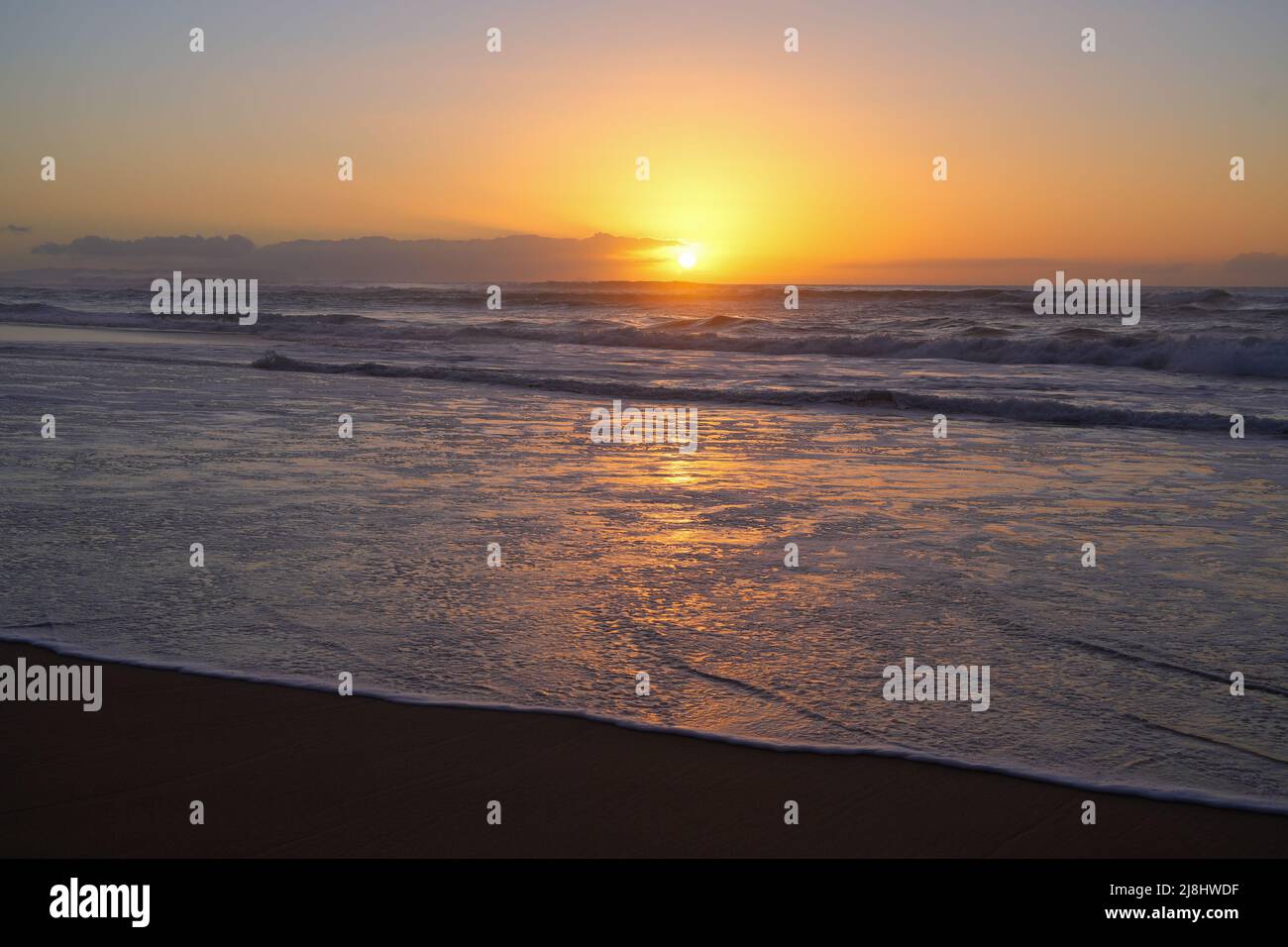 Sun setting on the beach of the Polihale State Park on Kauai island in ...