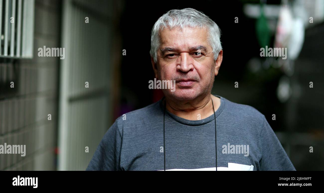 Serious older man looking at camera. Casual senior portrait serious ...