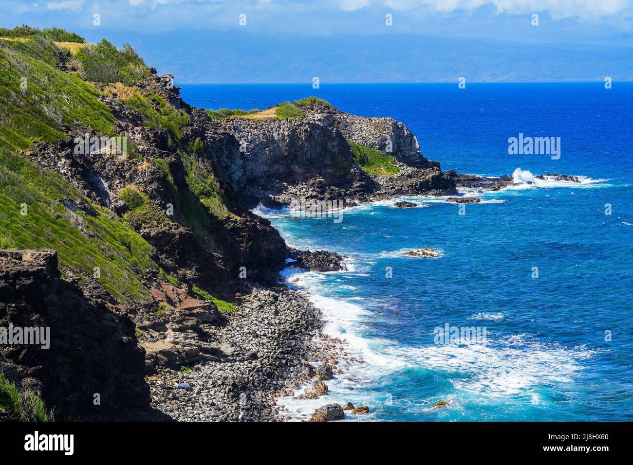 Aerial view of the cliffs of Lipoa Ridge above the Pacific Ocean along ...