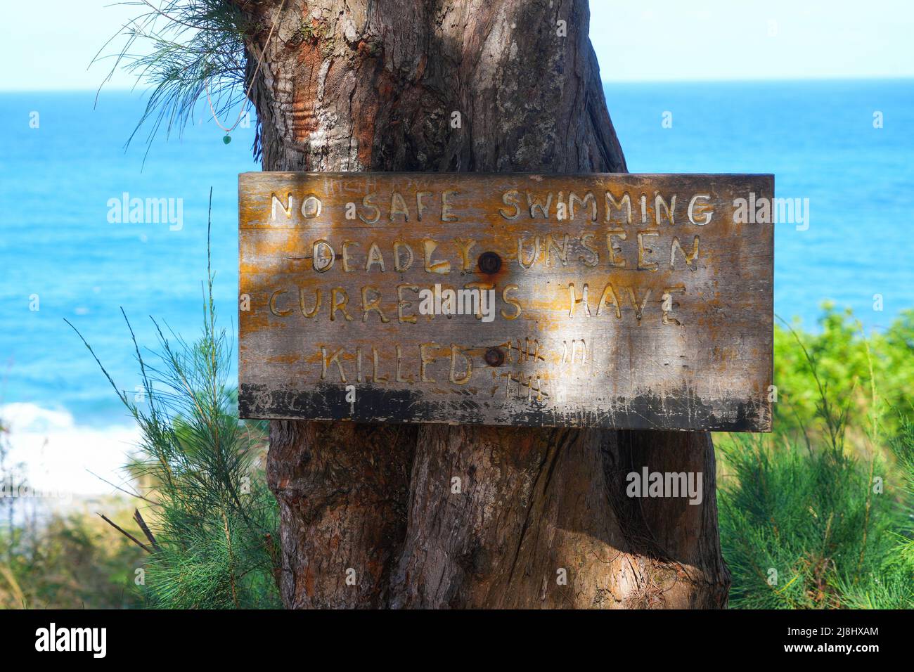 Wooden warning sign forbidding swimming on Larson's Beach on the North ...