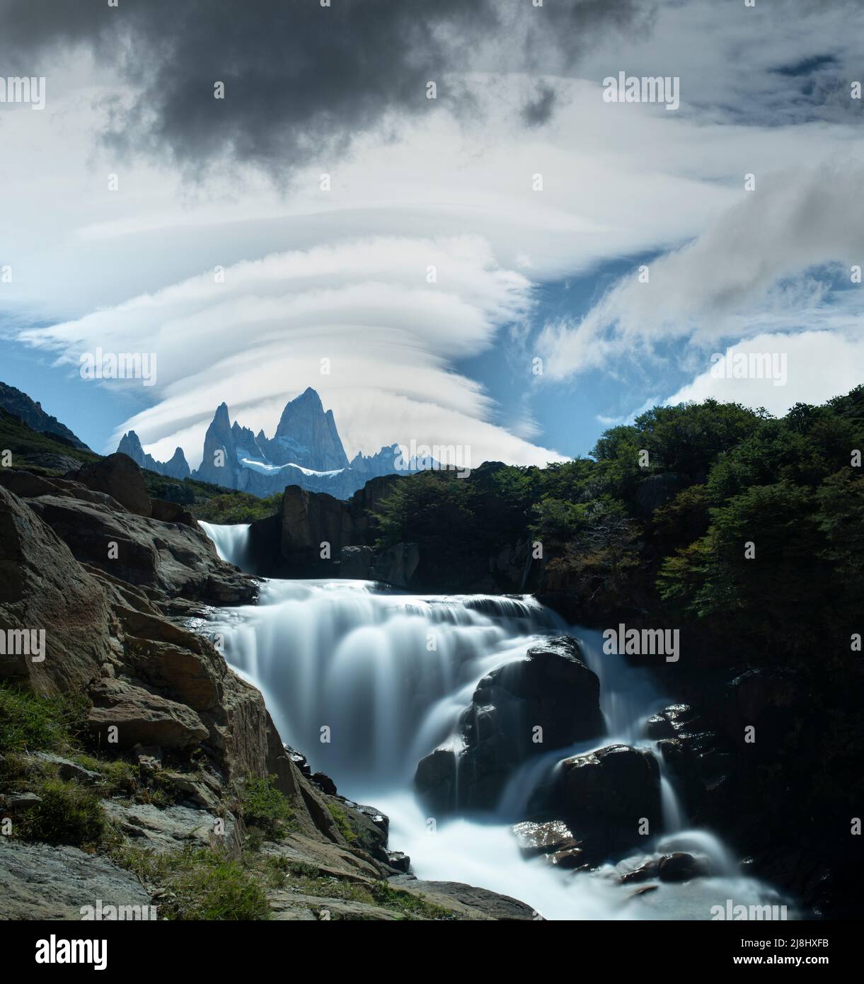 A big waterfall cascades before the Fitzroy massif, the iconic p Stock ...