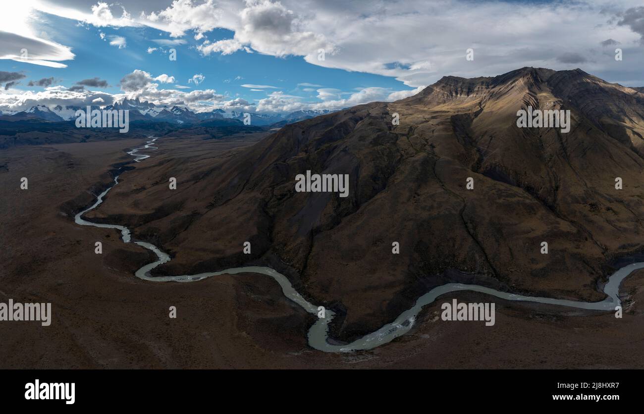 A small river winds its way out of the Patagonian mountains Stock Photo ...
