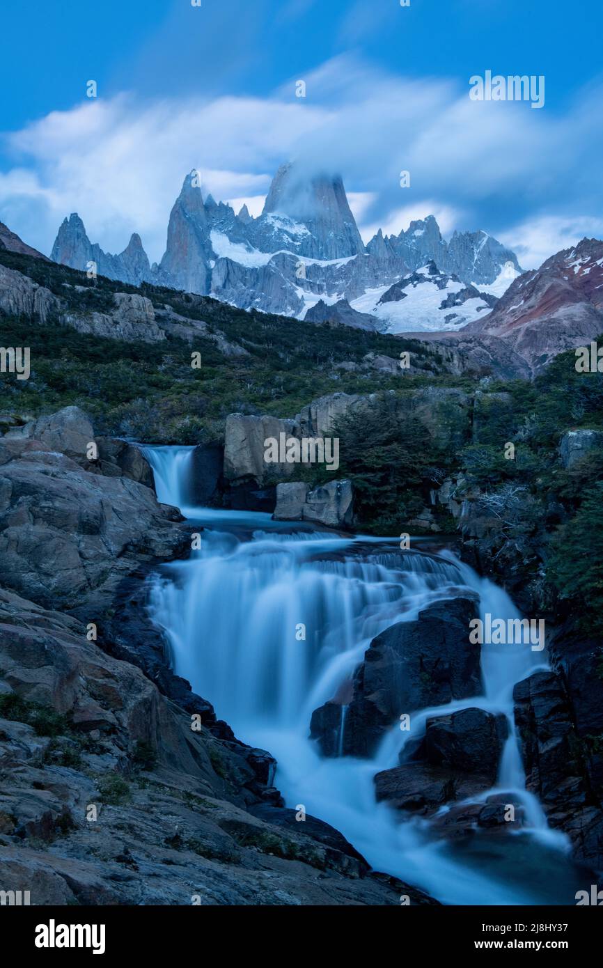 A big waterfall cascades before the Fitzroy massif, the iconic p Stock ...