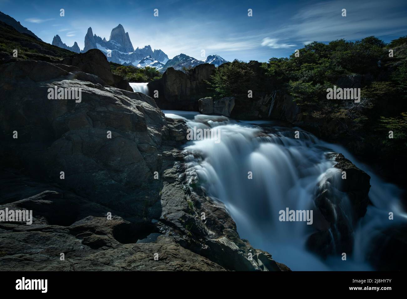 A big waterfall cascades before the Fitzroy massif, the iconic p Stock ...
