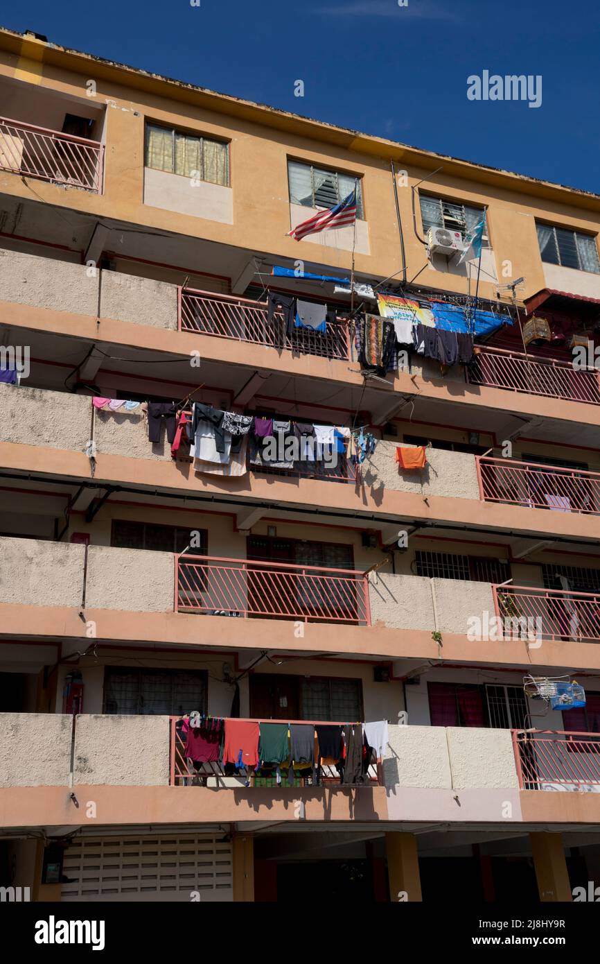 Clothes drying in the sun in balconies of municipal apartment buildings ...
