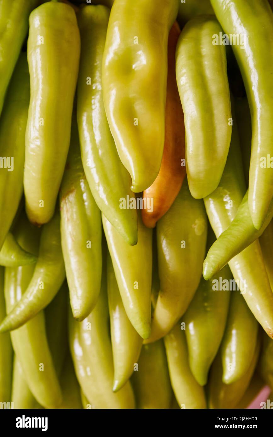 Chiles gueros put on a shelf for sale within a market Stock Photo - Alamy