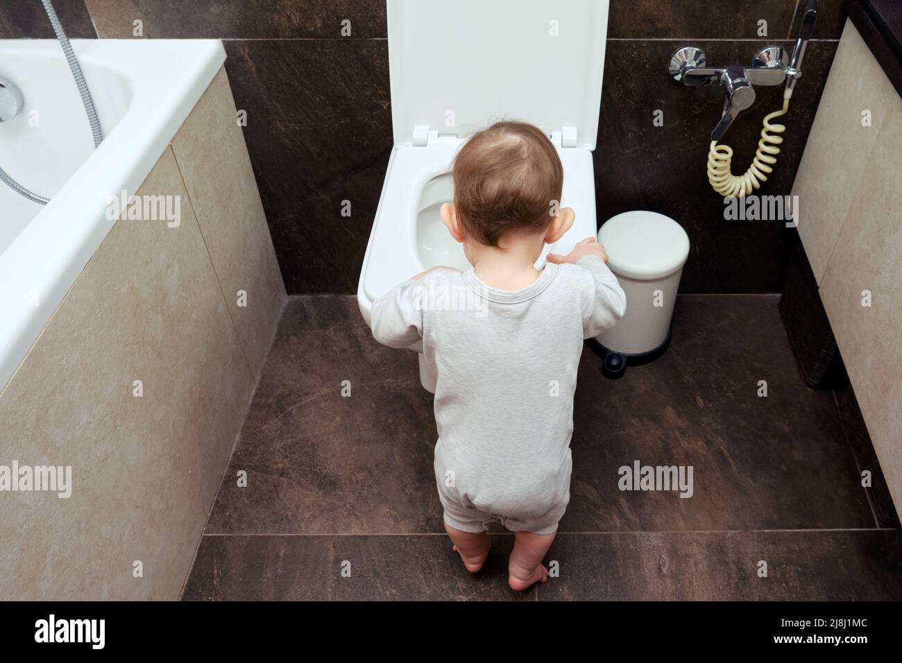 Boy child flushing toilet hi-res stock photography and images - Alamy
