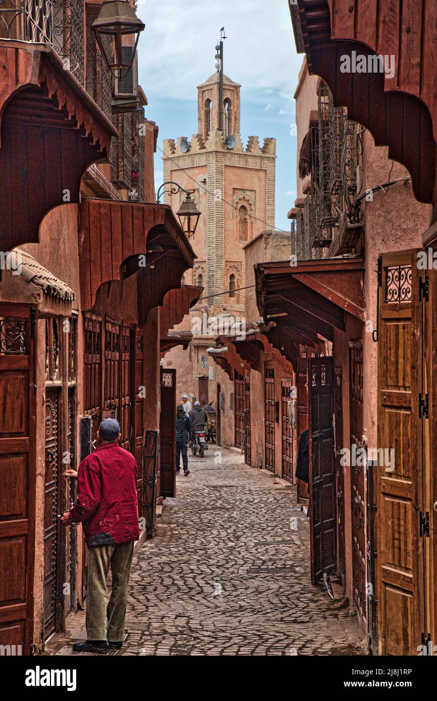 MARRAKECH, MOROCCO - FEBRUARY 20, 2022: People visit streets of medina ...