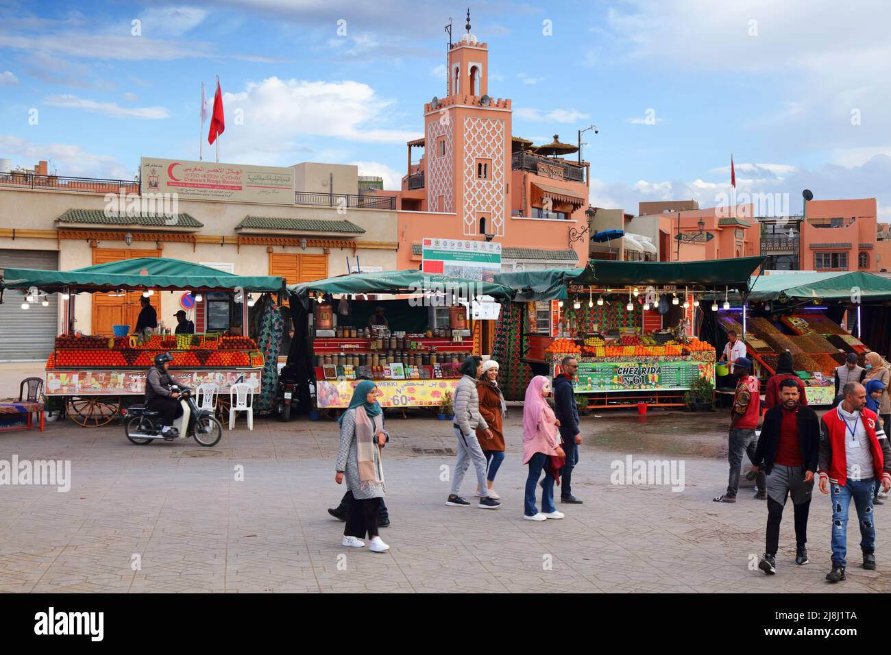 MARRAKECH, MOROCCO - FEBRUARY 20, 2022: People visit Jamaa el-Fnaa ...