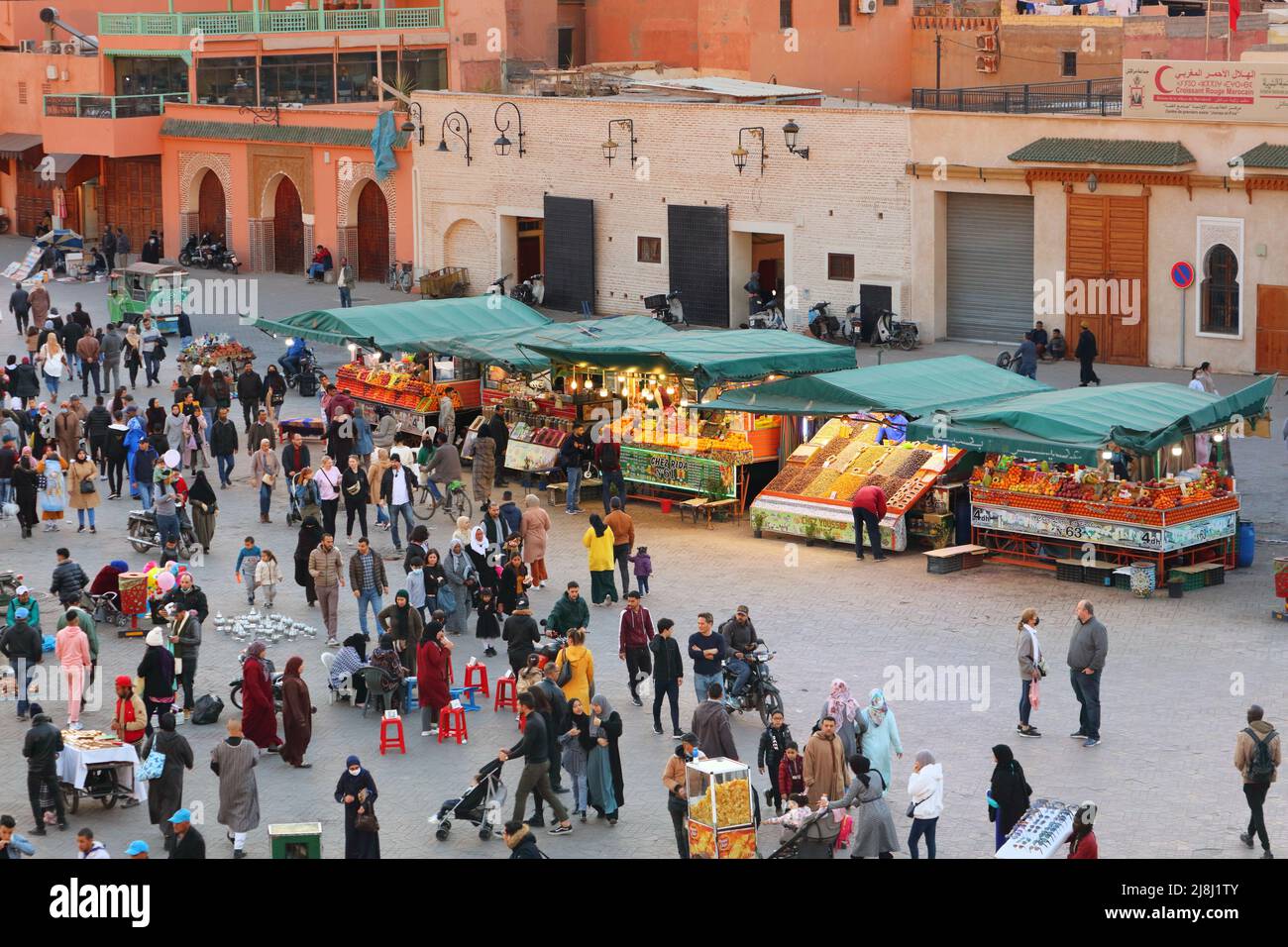 MARRAKECH, MOROCCO - FEBRUARY 20, 2022: People visit Jamaa el-Fnaa ...