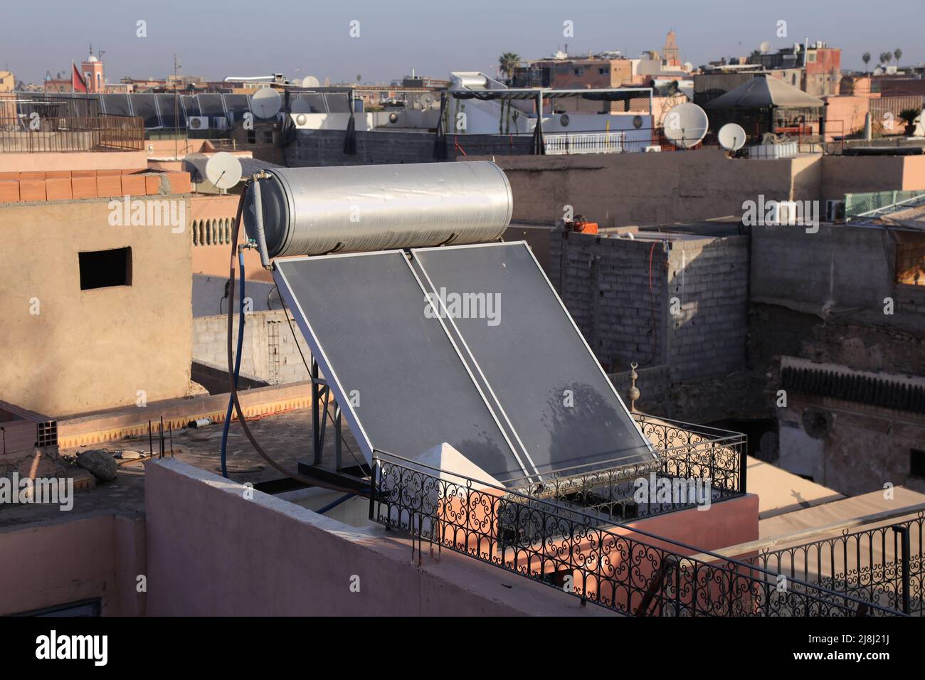 Marrakech city rooftop solar water heater in Morocco Stock Photo - Alamy