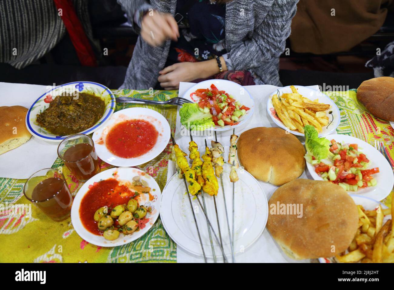 Tangia, Moroccan salad and barbecued meat skewers. Food of Jamaa El ...