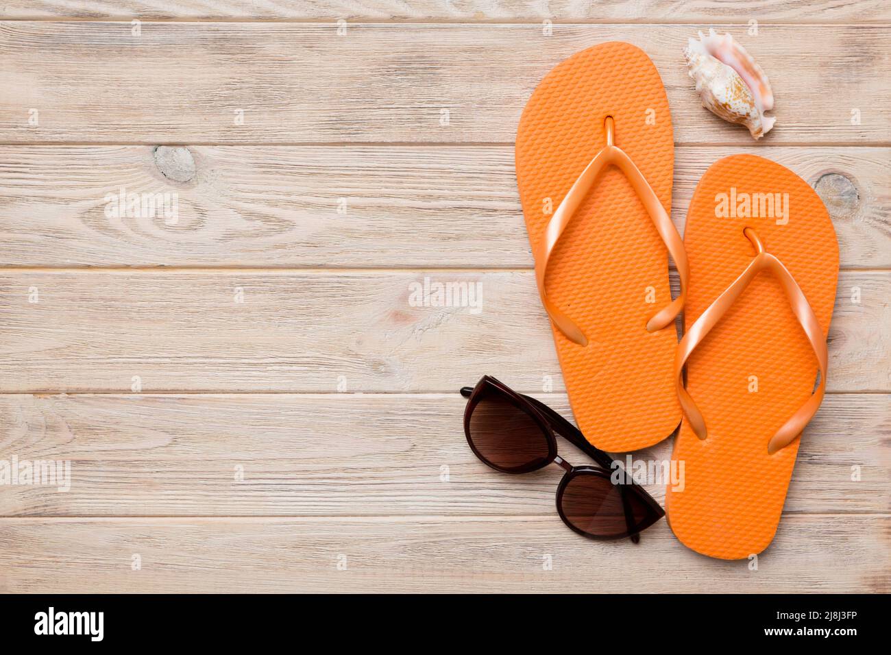 Summer travel concept. Flip flops, sunglasses and starfish on white ...
