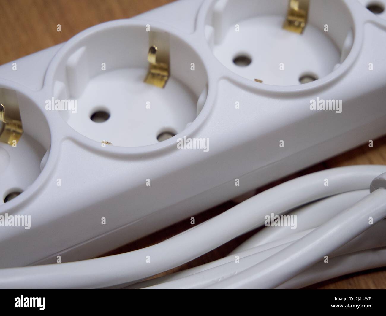 Tee for European plug. White extension cord, close-up shot Stock Photo ...