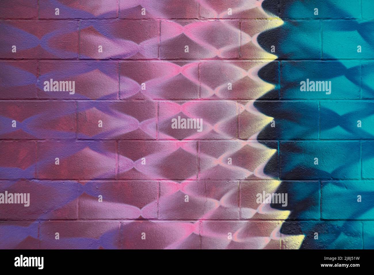 Colorful painted block wall in city alley Stock Photo - Alamy