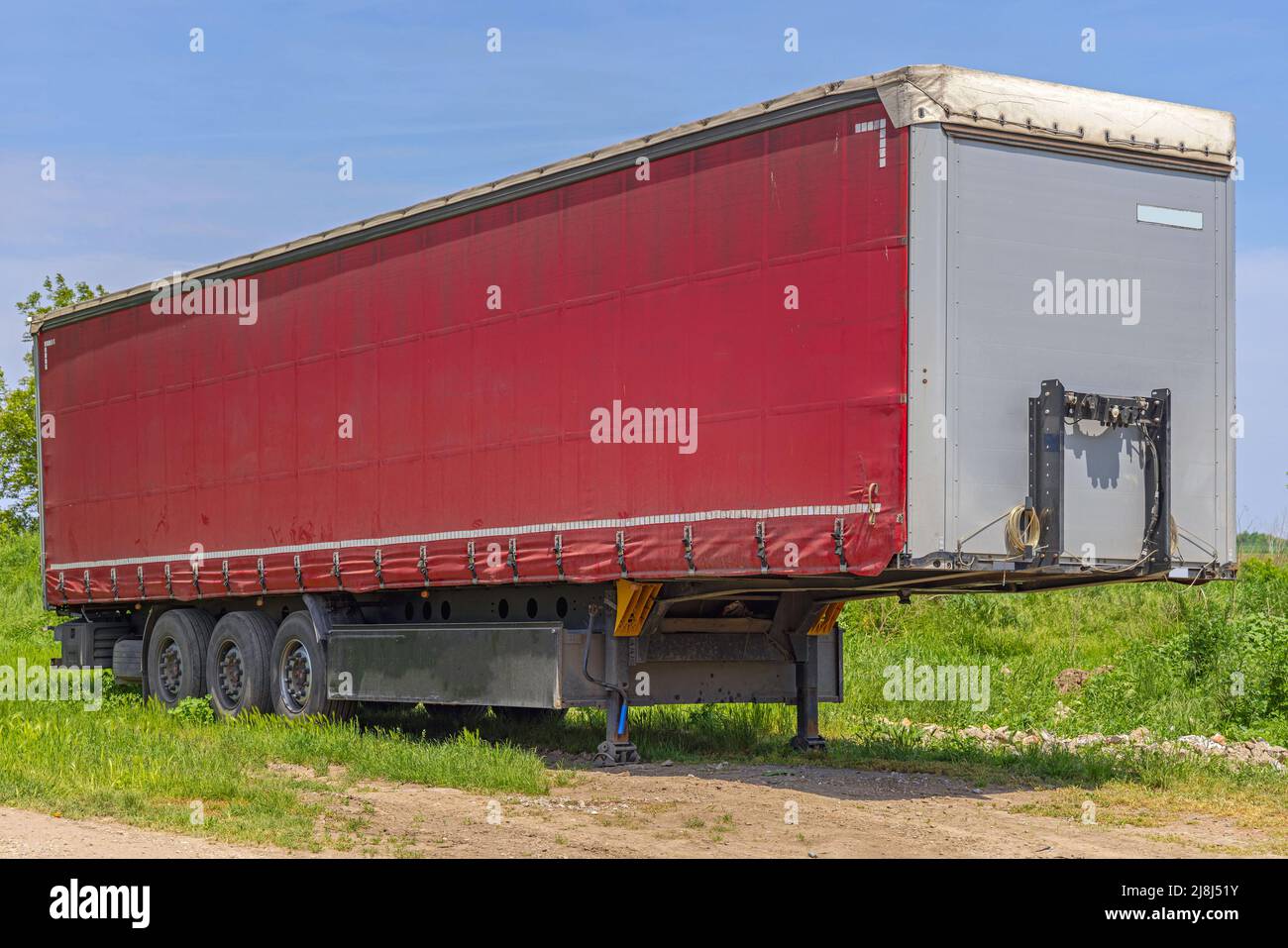 Red Lorry Cargo Trailer Parked at Grass Field Stock Photo - Alamy
