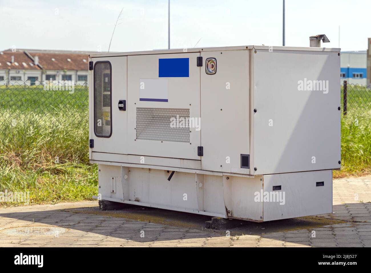Stand By Electrical Power Generator Behind Industrial Building Stock ...