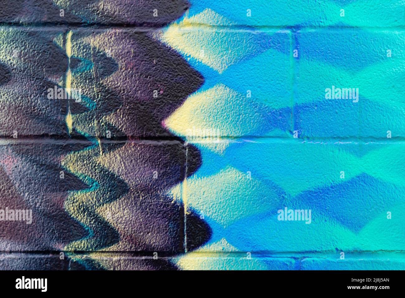 Colorful painted block wall in city alley Stock Photo - Alamy