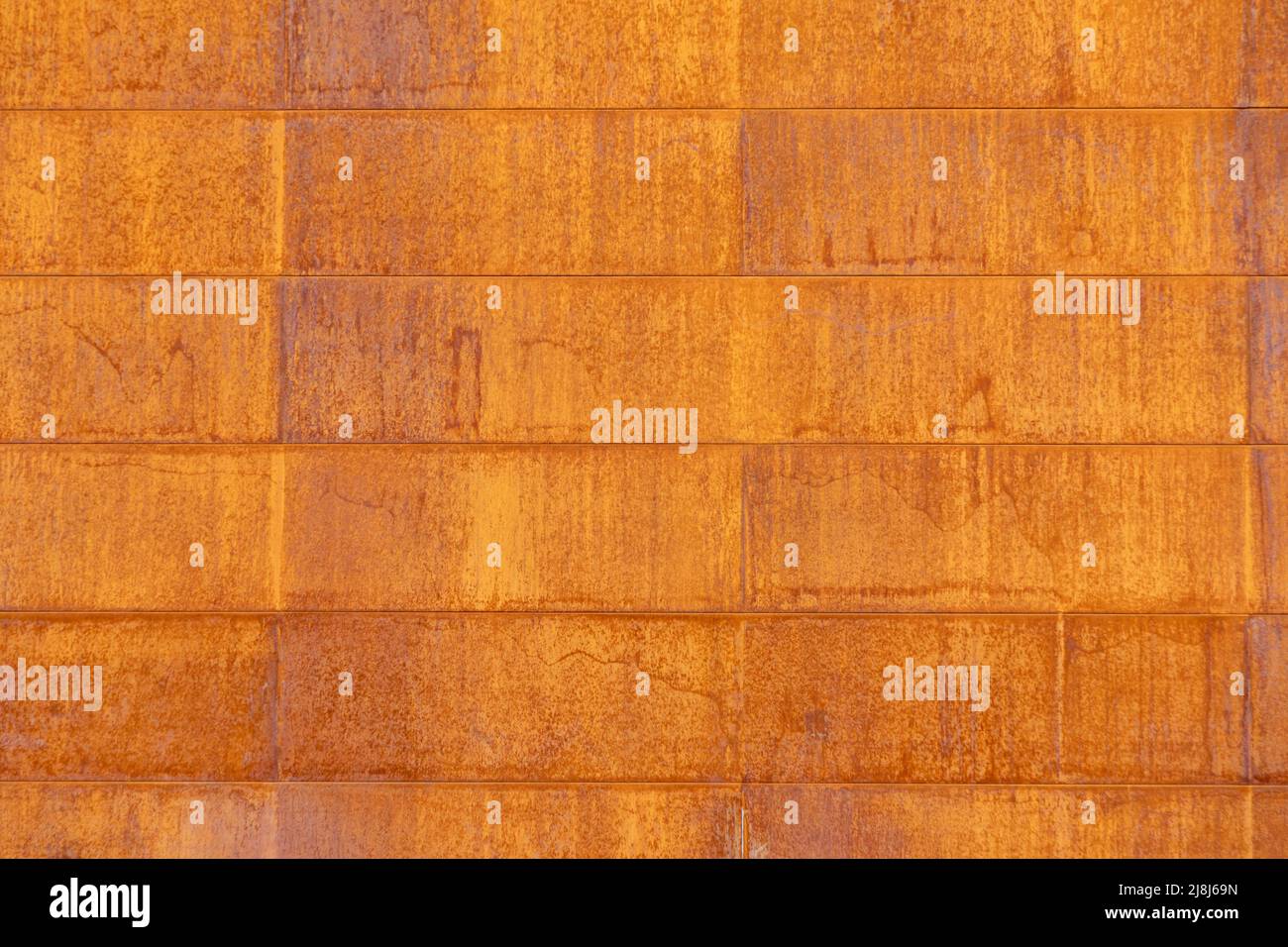 old rusty metal plates at the wall gives a harmonic background Stock ...