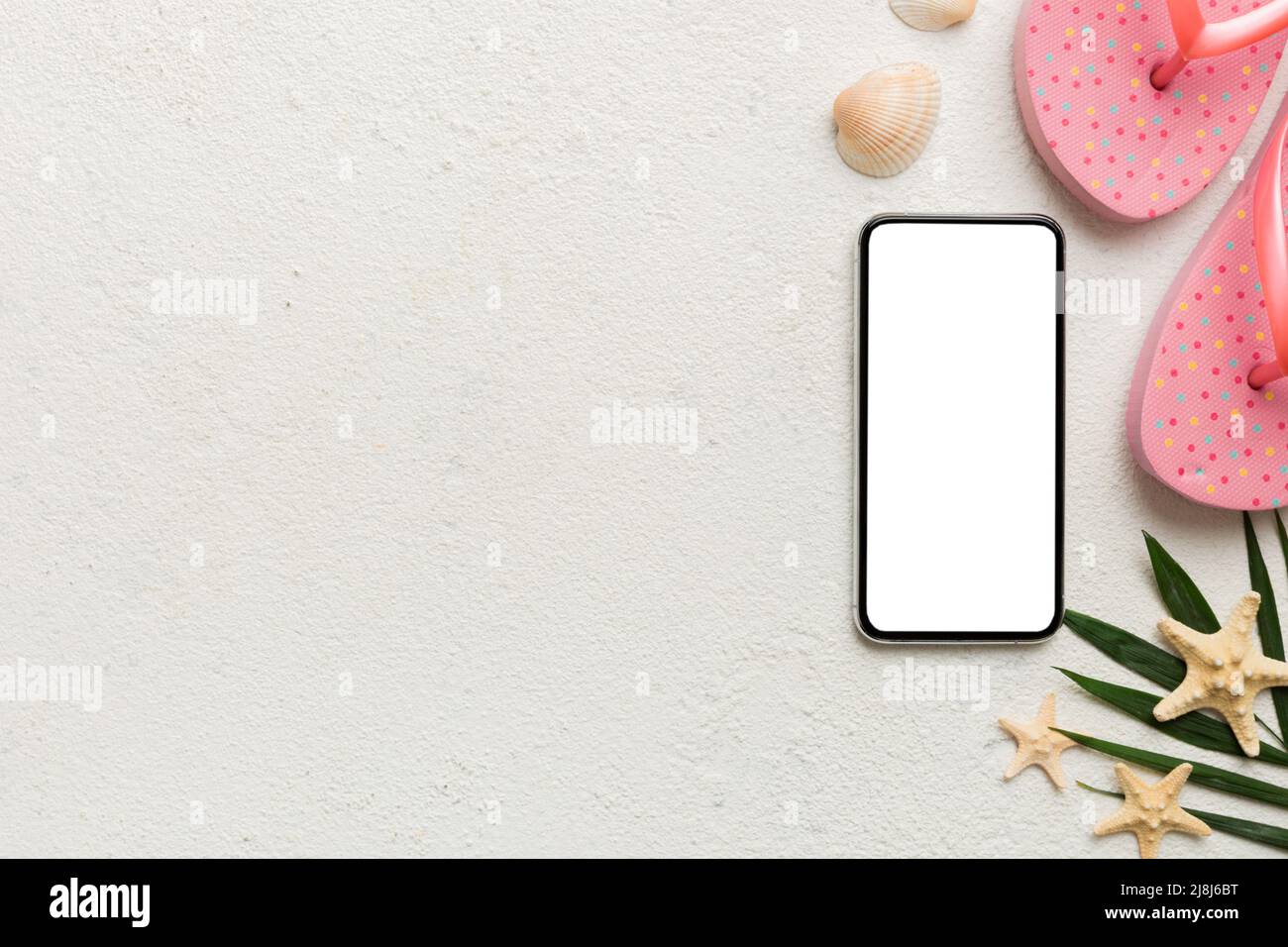 Flat lay composition with Phone and beach accessories on colored ...