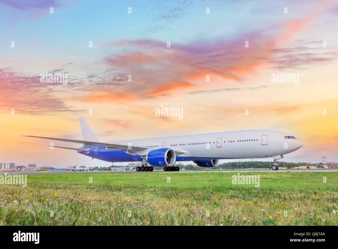 Heavy wide-body long-haul jet aircraft taxis to the runway for takeoff ...