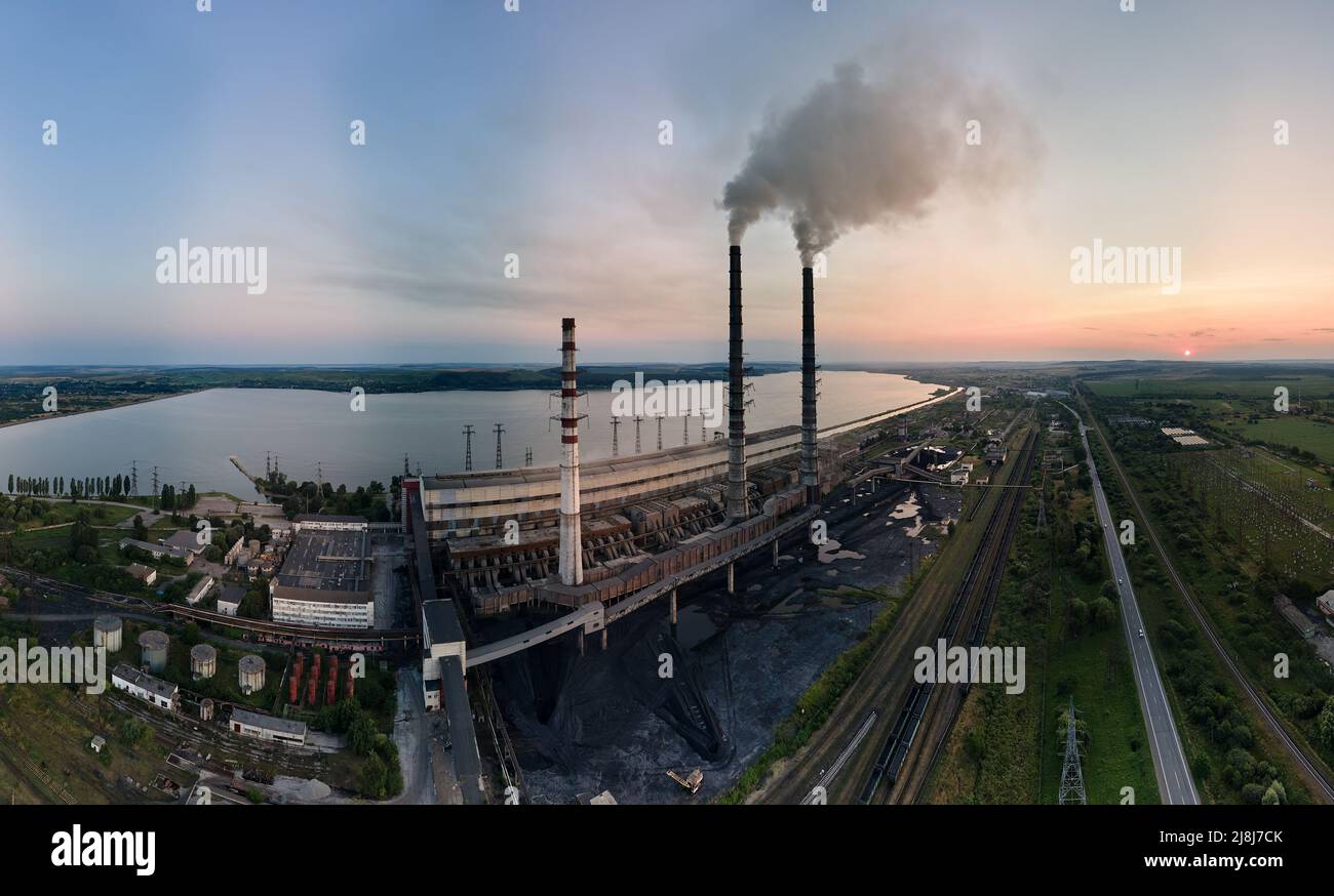 Aerial view of coal power plant high pipes with black smokestack ...