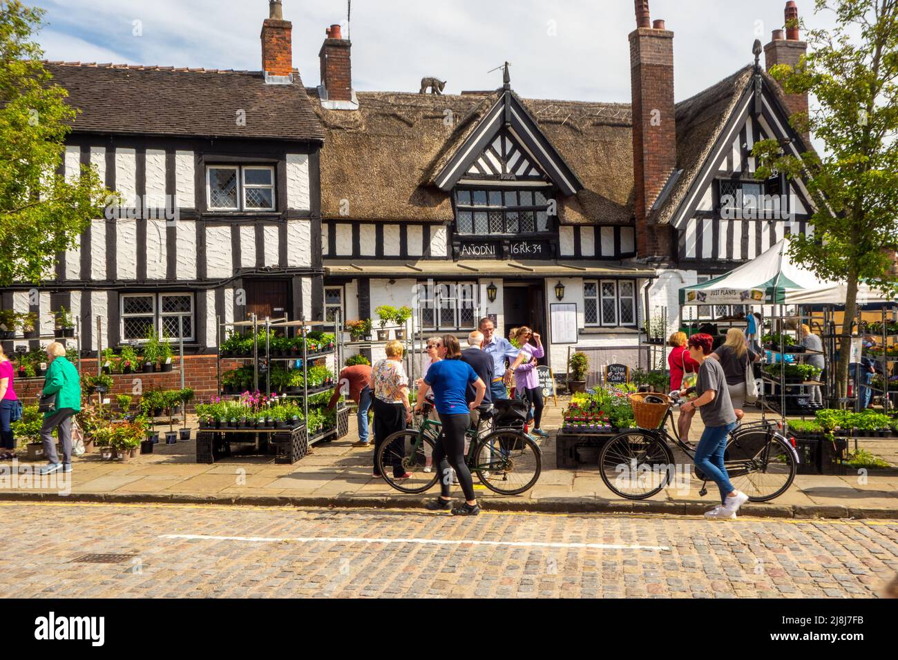 People outside the Black Bear inn at the farmers makers market in the ...