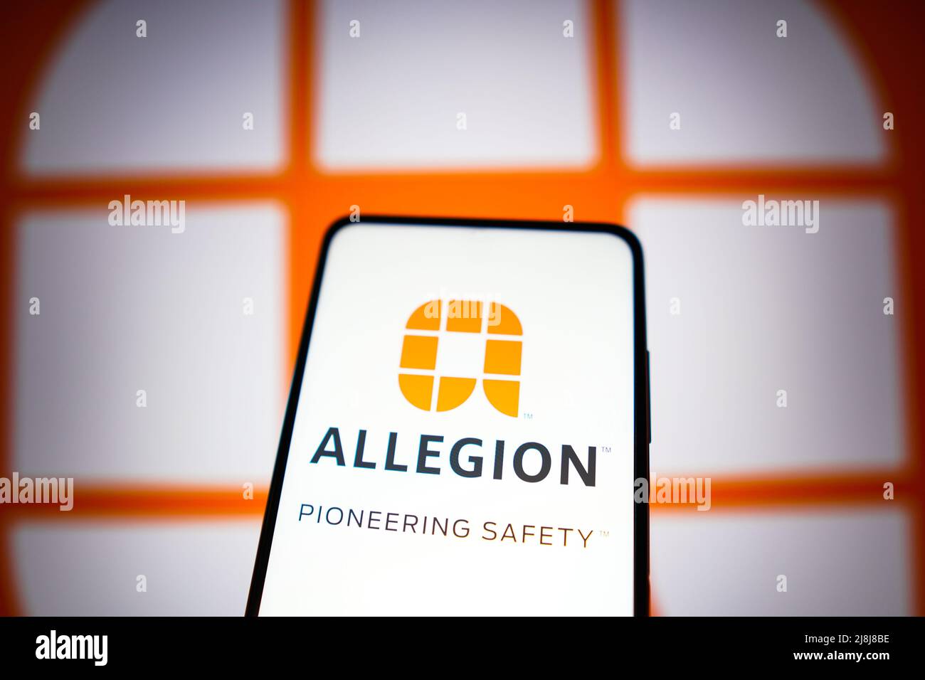 In this photo illustration the Allegion plc logo seen displayed on a ...
