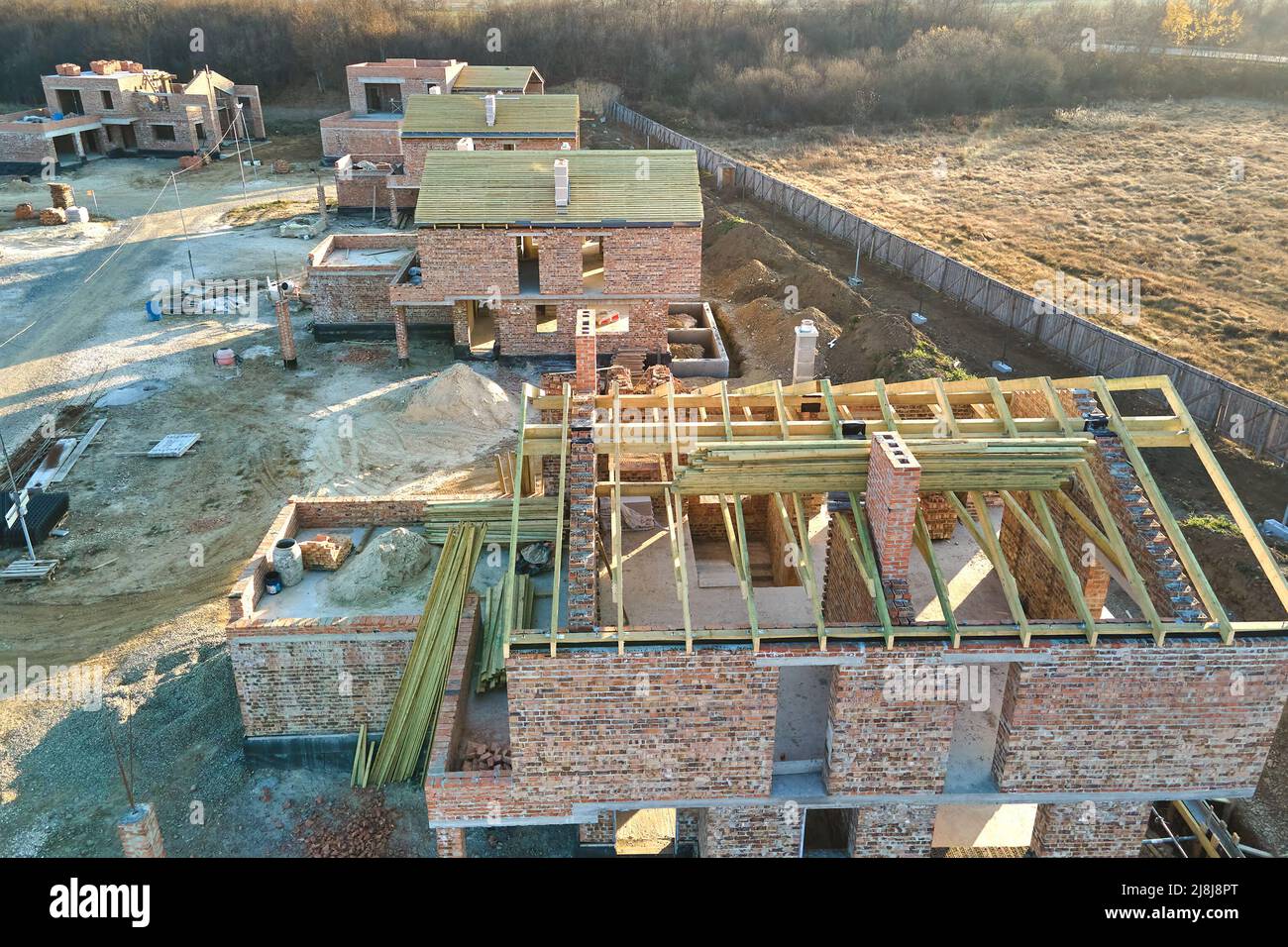 Aerial view of residential houses under construction in rural suburban ...